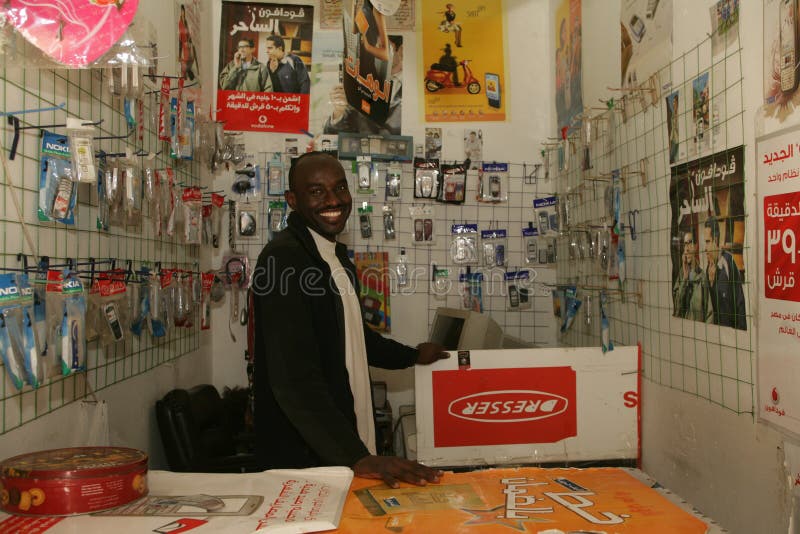 A Sudanese Refugee in His Mobile Phone Shop Editorial Photo - Image of ...