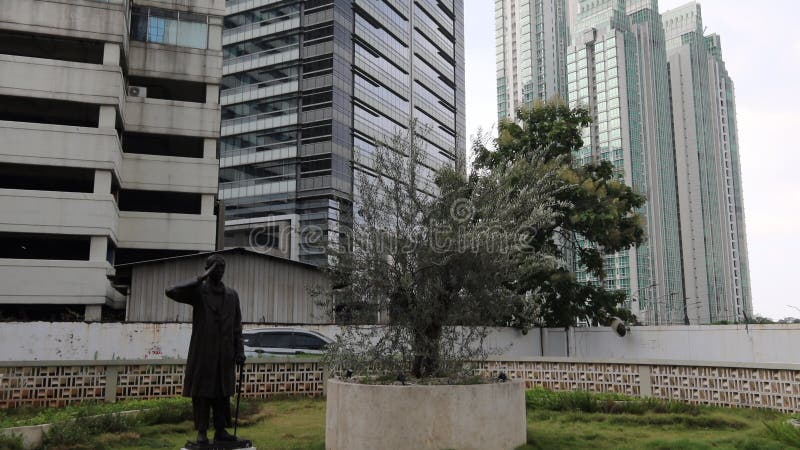 Sudirman Statue in the Park with a Backdrop of High-rise Buildings ...