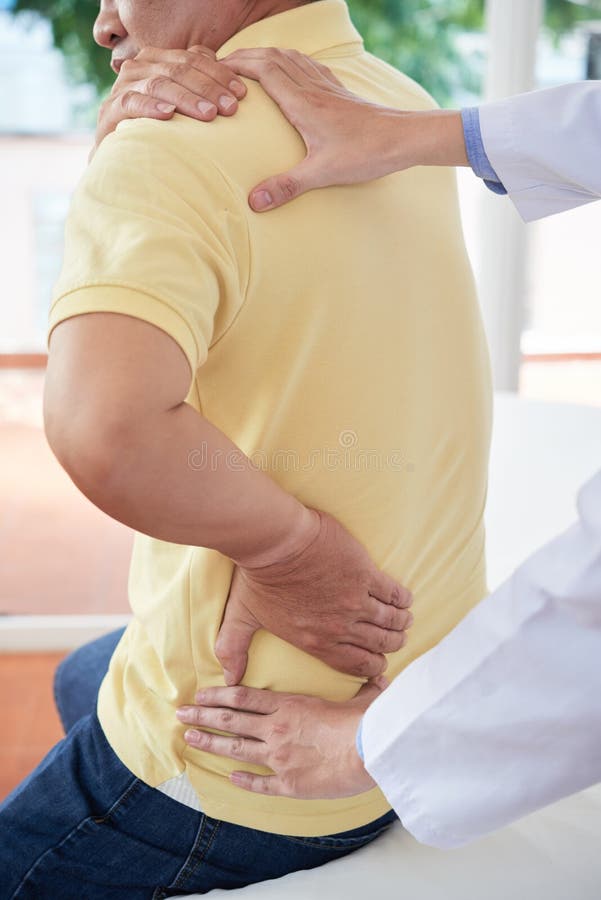 Suffering from back pain stock photo. Image of spine - 131669154