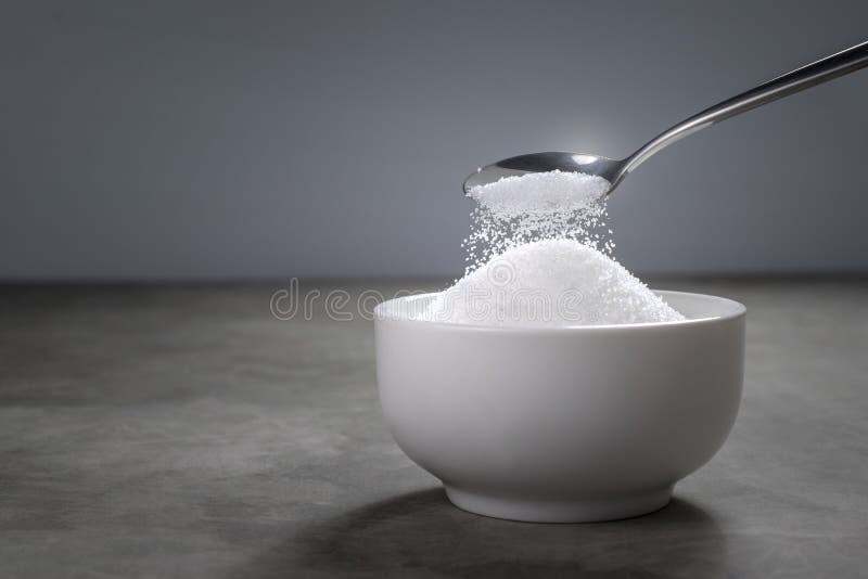 Sugar Being Poured from Spoon into a Bowl Empty Ready for Your P Stock ...