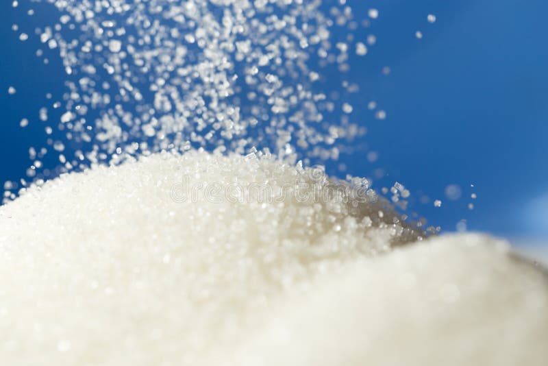 Sugar on a blue background stock photo. Image of blue - 100388034