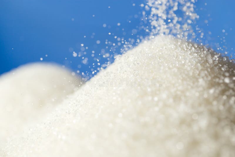 Sugar on a blue background stock photo. Image of sweet - 101874480
