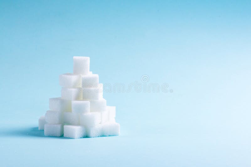 Sugar on blue background stock image. Image of food - 295501935