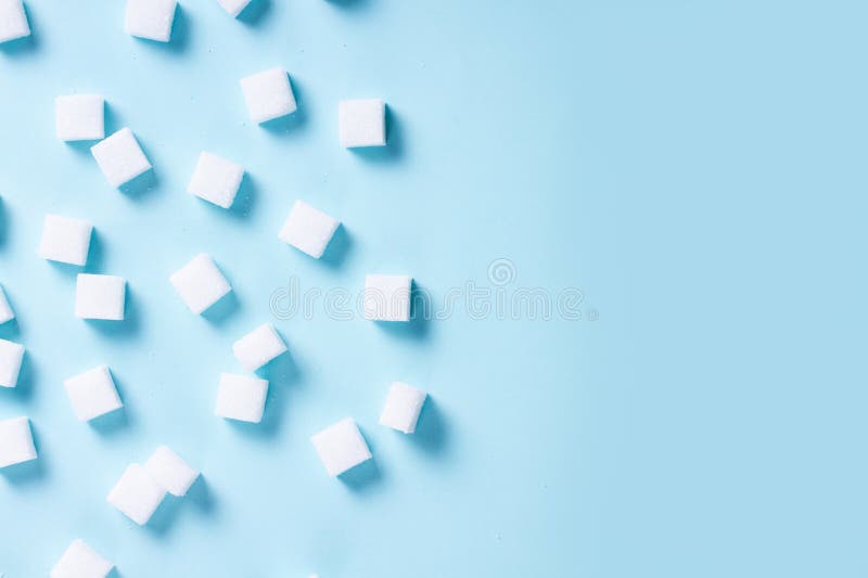 Sugar on blue background stock image. Image of crystalline - 295502271