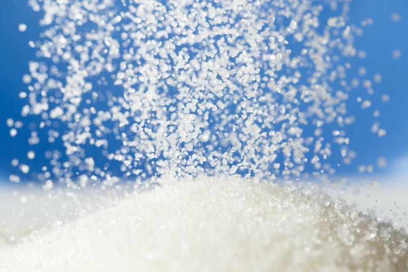 Sugar on a blue background stock image. Image of granulated - 101378149