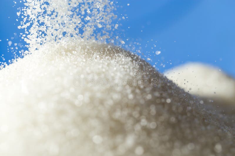 Sugar on a blue background stock photo. Image of sweet - 104187316