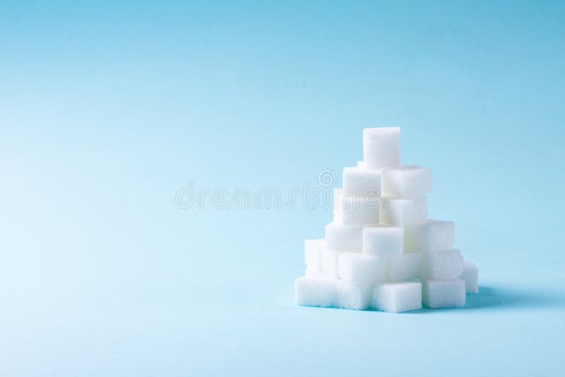 Sugar on blue background stock photo. Image of crystalline - 129461062