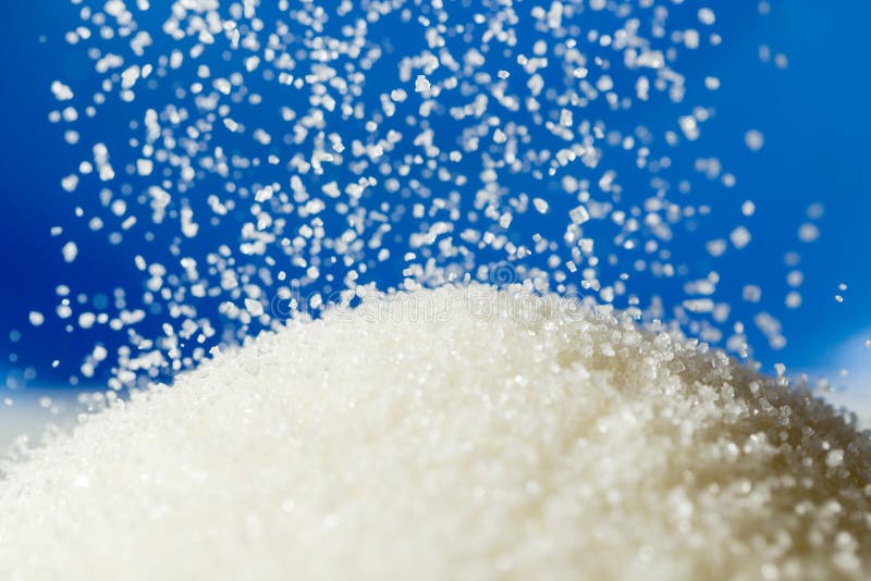 Sugar on a blue background stock photo. Image of snow - 100388226