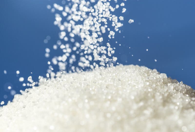 Sugar on a blue background stock image. Image of concept - 103694805