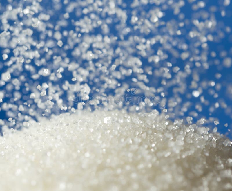 Sugar on a blue background stock photo. Image of cube - 101629508