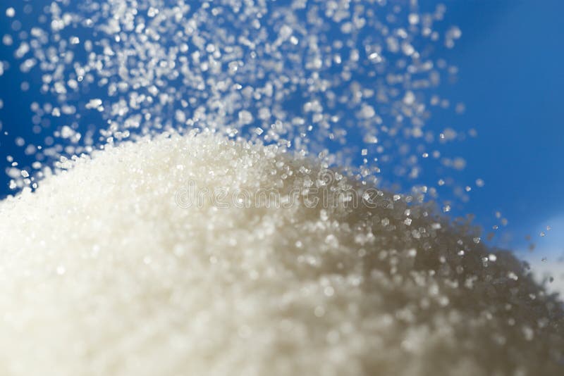 Sugar on a blue background stock image. Image of closeup - 103694981