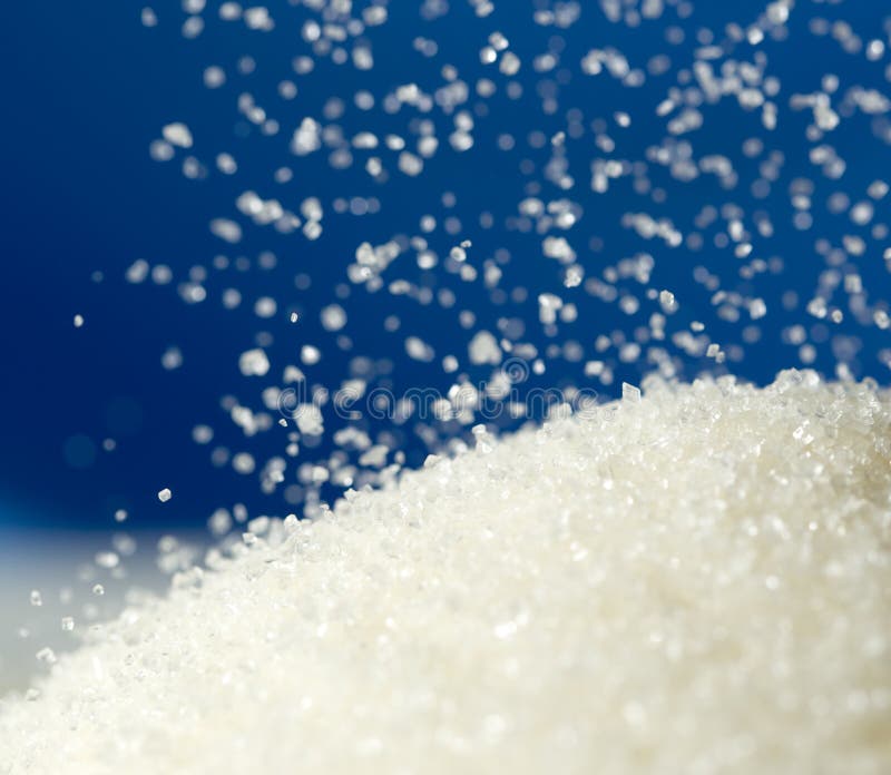Sugar on a blue background stock image. Image of concept - 104187329