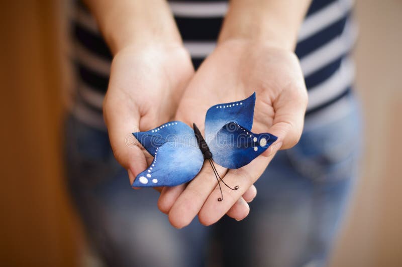 Sugar Blue Butterfly in the Hands of Women Stock Image - Image of brown ...