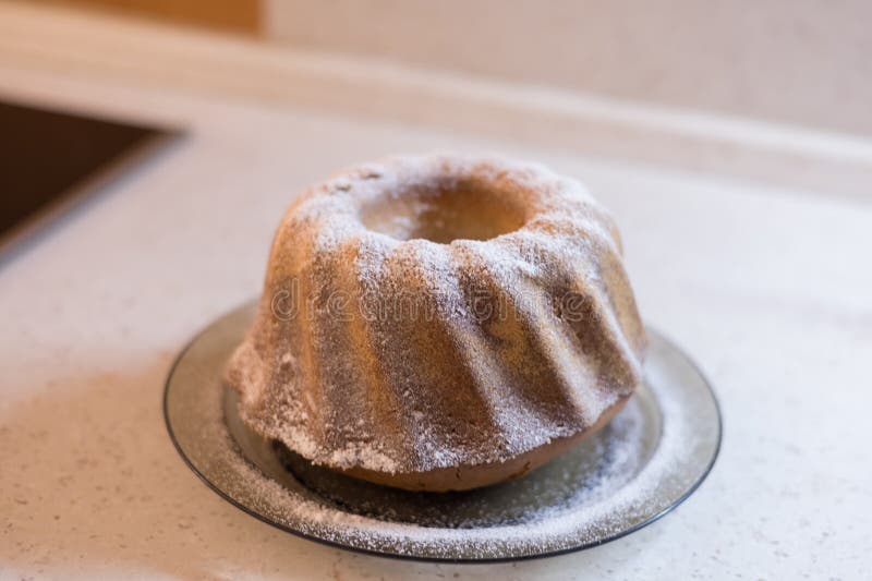 Sugar-coated Baked Sponge Cake on a Plate Stock Photo - Image of ...