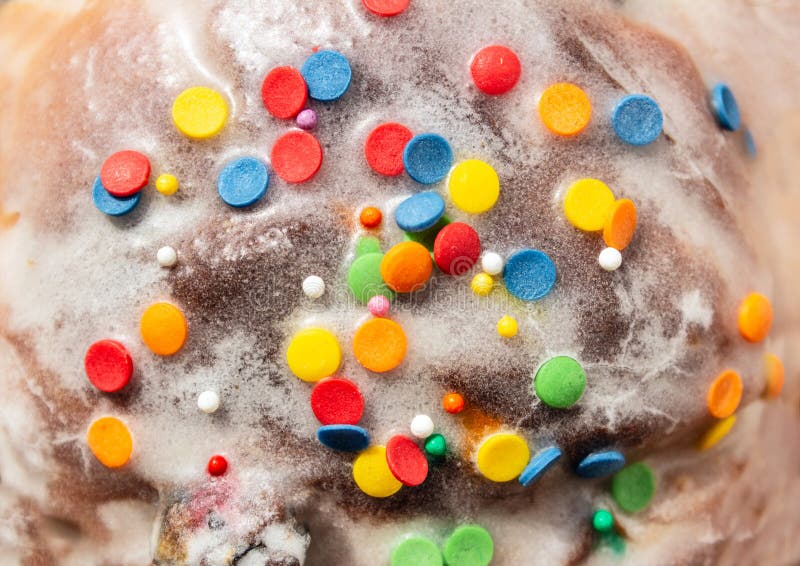 Sugar Colored Confetti Lies on a White Icing Easter Cake, Texture of ...