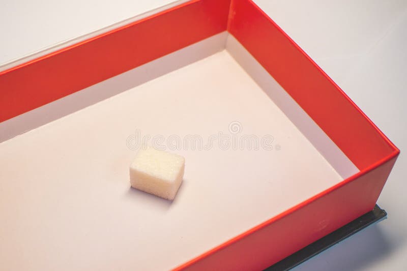 A Sugar Cube in a Box with Red Edges Stock Photo - Image of container ...