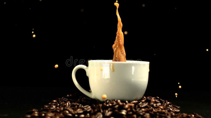 Coffee overflowing the cup stock footage. Video of density - 50033242