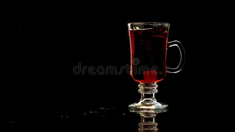 Sugar Cube Falling into Tea in a Glass Stock Video - Video of dropping ...