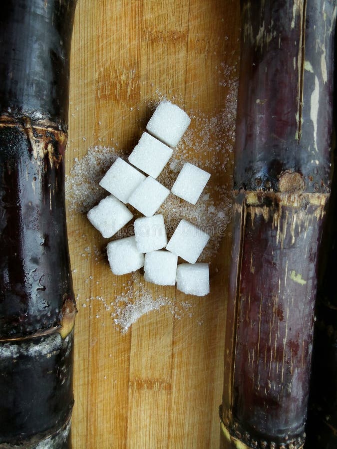Sugar Cubes and Red Sugar Cane Stock Image - Image of piled, pile: 35498359