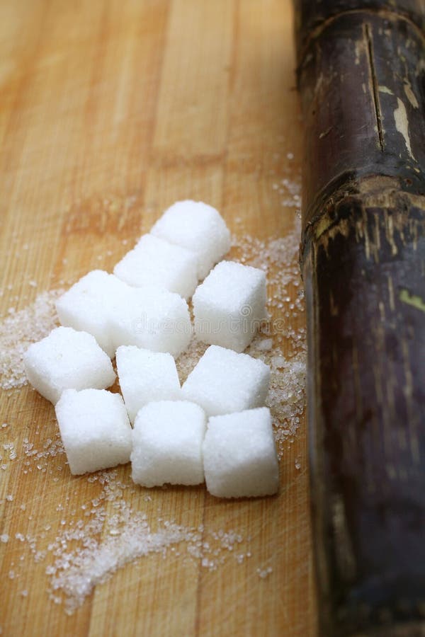 Sugar Cubes and Red Sugar Cane Stock Image - Image of piled, sweetener ...