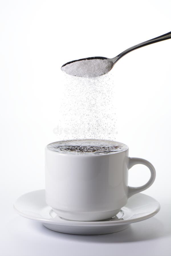 Sugar falling from a spoon stock photo. Image of coffee - 107605454