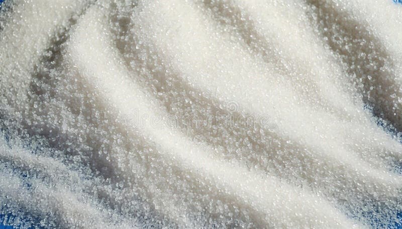 Sugar Granules Spread Across a Blue Surface Creating a Textured Visual ...