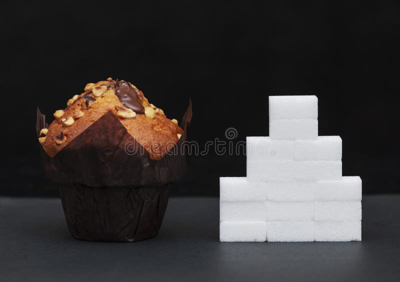 Sugar Level Next To the Cupcake, Cubes Sugar Stacked on Top of Each ...
