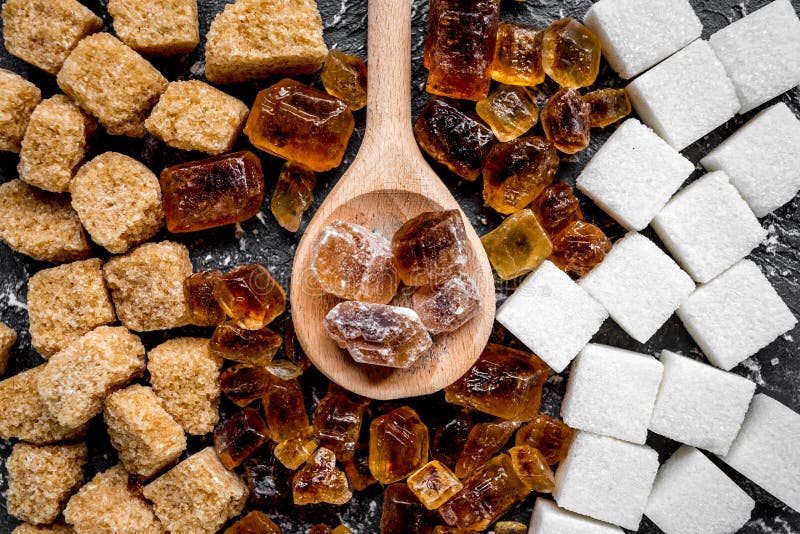 Sugar Lumps for Sweet Food Cooking on Kitchen Dark Table Top View ...
