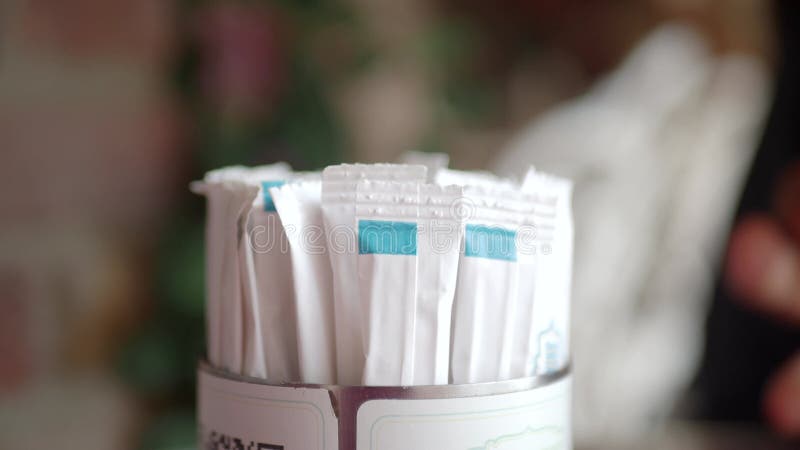Sugar Packets in a Cup on a Table at a Cafe during Morning Hours Stock ...