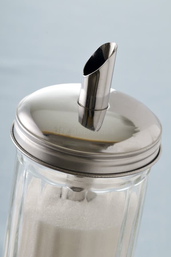 Pouring Sugar in Jar from Measuring Cup Stock Photo - Image of bottle ...