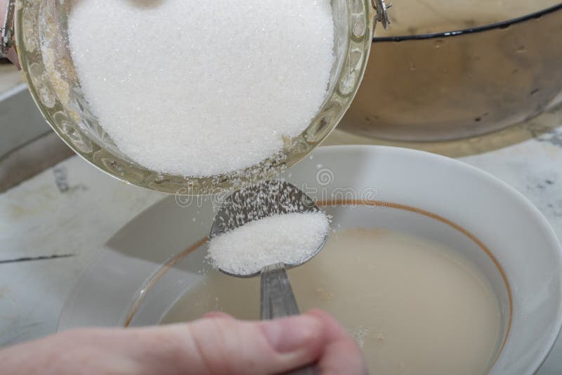 Sugar is Poured into a Spoon Stock Photo - Image of cook, bowl: 187753770