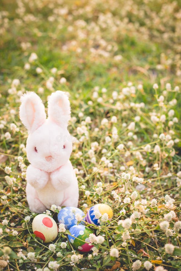 Sugar Rabbit and Easter Eggs on Meadow. Stock Photo - Image of colorful ...