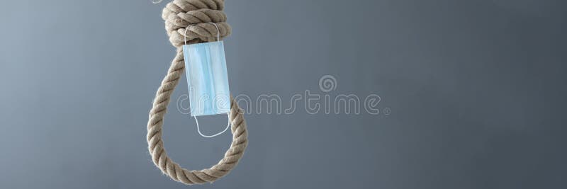 Suicide Rope Loop and Protective Face Mask Hanging from Ceiling Stock ...