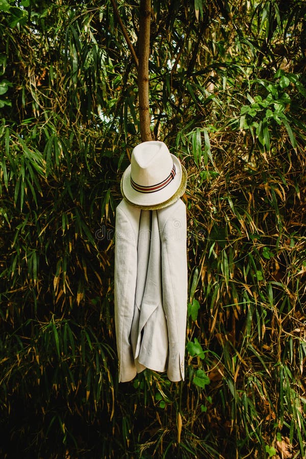 Suit and Hat of Man Hanging from a Tree during a Summer Event Stock ...