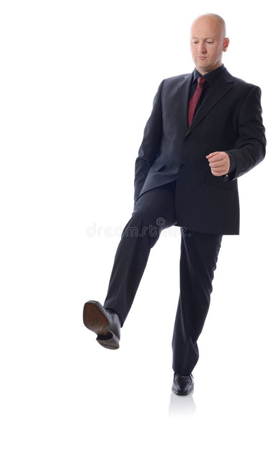 Suit stepping on something stock image. Image of business - 26888363