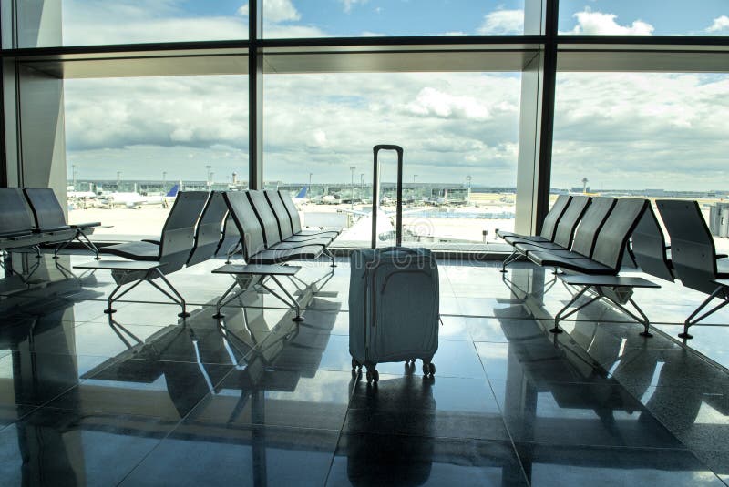 Suitcase in the Airport Room with a View of the Airport Stock Image ...