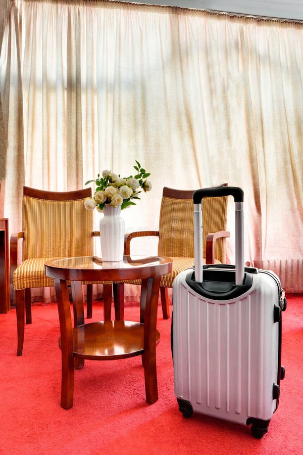 Suitcase in the hotel room stock image. Image of home - 261314253