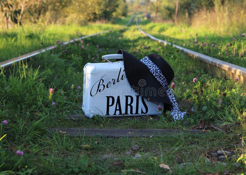 Suitcase Old with Inscription BERLIN PARIS and Hat on Railway Tracks ...