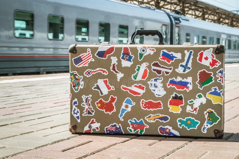 Suitcase with Stickers from Around the World Stands Stock Photo - Image ...