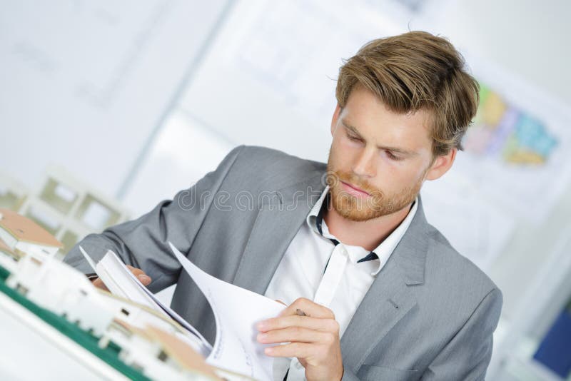 Suited Man Working on Model Development Stock Image - Image of business ...