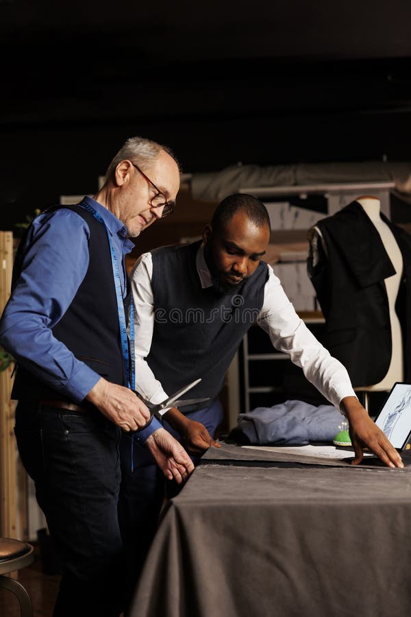 Suitmaker and Apprentice Cutting Fabric Stock Image - Image of ...