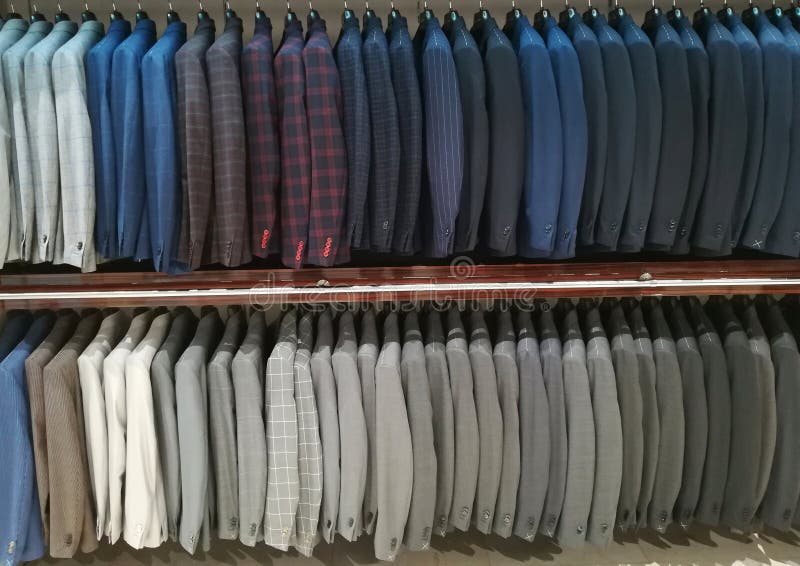 Suits for men in a shop stock image. Image of jackets - 101634661