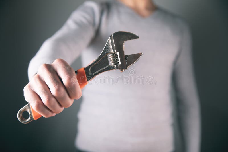 Sujetar una llave imagen de archivo. Imagen de mano - 216021439