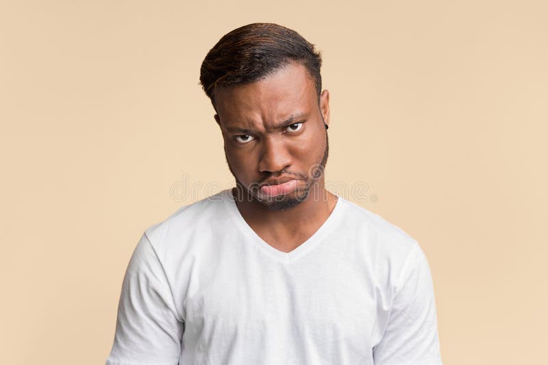 Sulky Afro Guy Looking at Camera Posing Over Yellow Background Stock ...