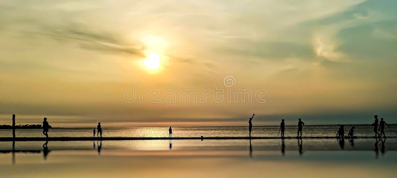 Sum Guys Playing on the Beach at the Evening Time Stock Photo - Image ...