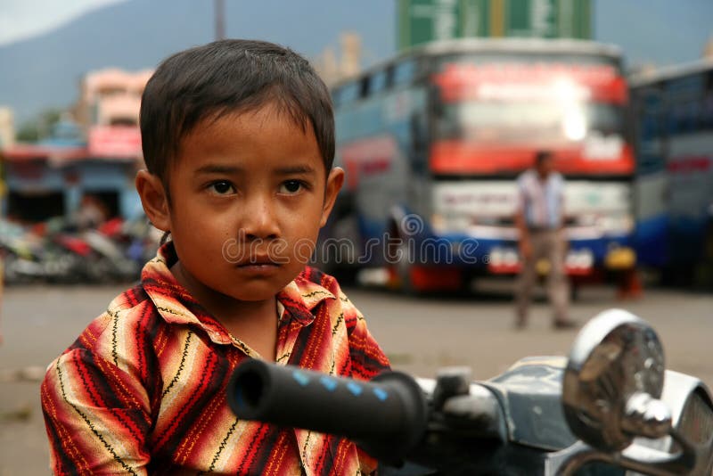 Sumatran boy on a bike editorial photo. Image of nationality - 24133861