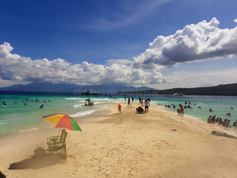 Aerial View of the Sumilon Island, Sandy Beach with Tourists Swimming ...