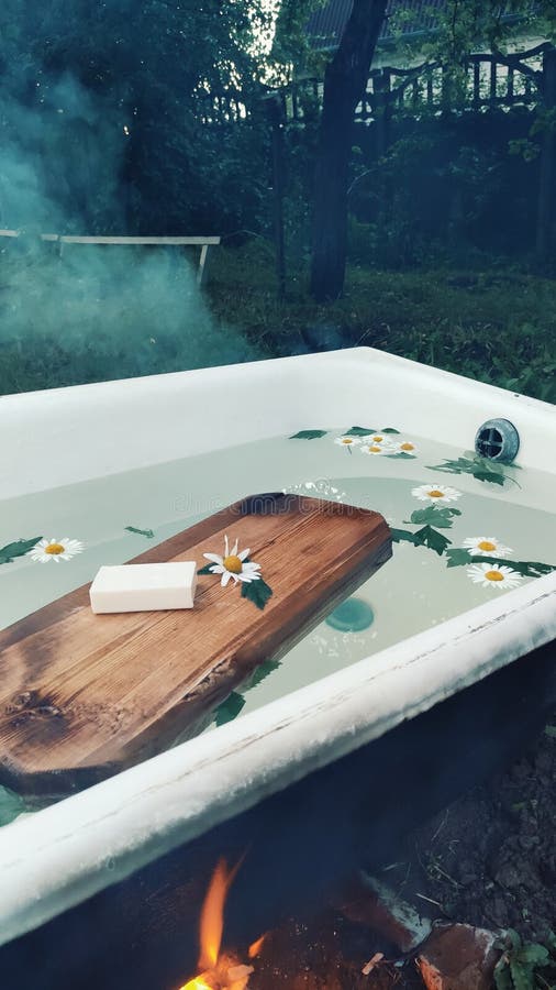 Summer bath with chamomile stock image. Image of summer - 222572007