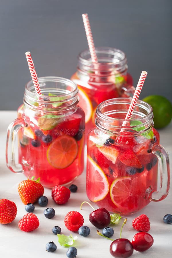 Summer Berry Lemonade with Lime and Mint in Mason Jar Stock Photo ...