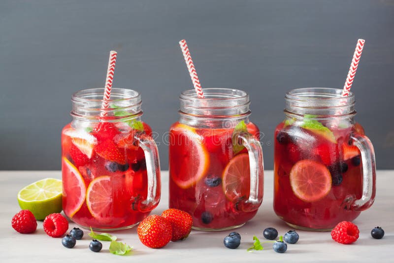 Summer Berry Lemonade with Lime and Mint in Mason Jar Stock Photo ...